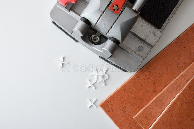 Tile Cutter and Tiles on White Table with Spacers Stock Image - Image ...