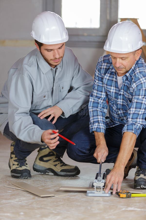 Apprentice Tile Setter Cutting Tile Stock Image - Image of duty ...