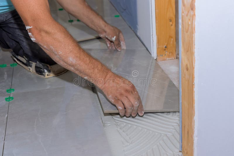 Tile Installation on Adhesive Surfaces during Home Construction Stock ...