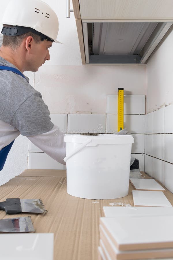 The Tile Installation Wizard Measures the Correct Laying of White Tiles ...