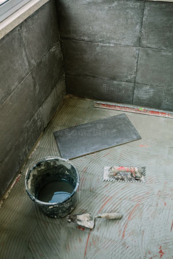 Tile laying work on floor stock image. Image of laying - 202507759