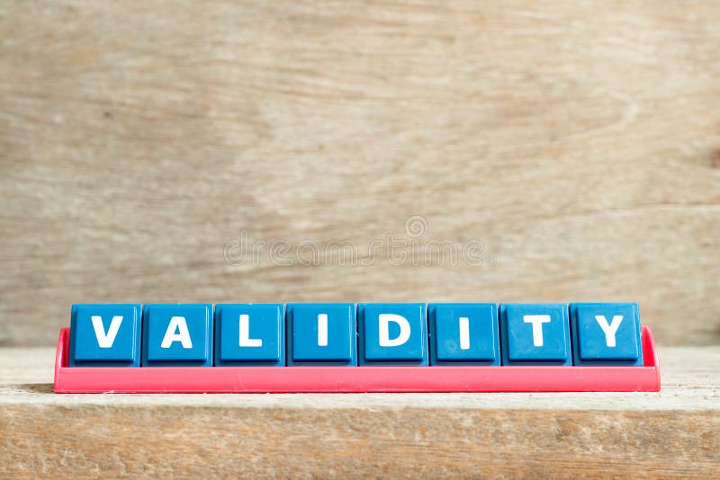 Tile Letter on Rack in Word Validity on Wood Background Stock Image ...