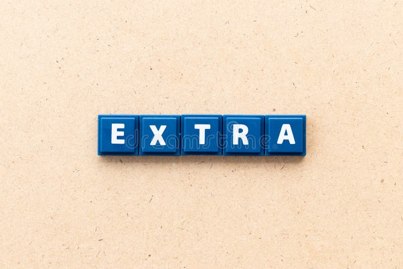 Word Extra Made with Black Letters on Wooden Blocks on Table Stock ...