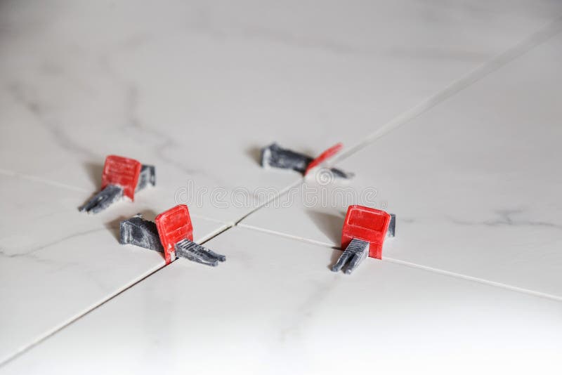 Tile Leveling System with Plastic Clips and Wedges Stock Photo - Image ...