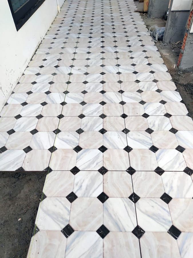 Tile Work. Flooring of Kitchen Tiles in the Building Stock Photo ...