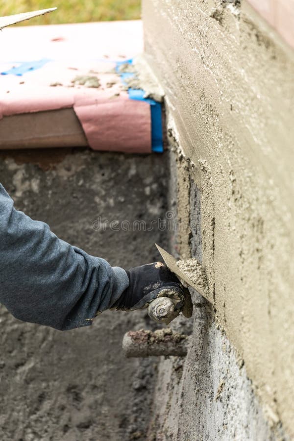 Tile Worker Applying Cement with Trowel at Pool Construction Site Stock ...