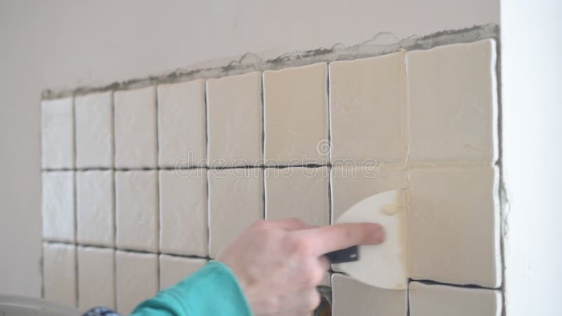 Tile Worker Filling Gaps between Tiles with Grout Stock Video - Video ...