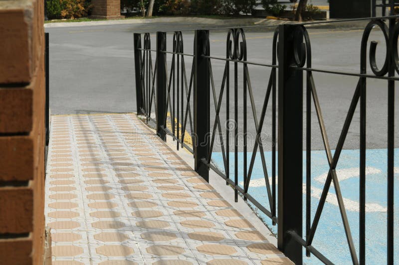 Tiled Ramp with Black Metal Railings Outdoors Stock Photo - Image of ...