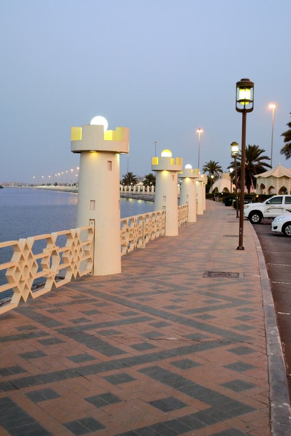 Tiled Walkway Along Water Front Channel at Twilight Stock Image - Image ...