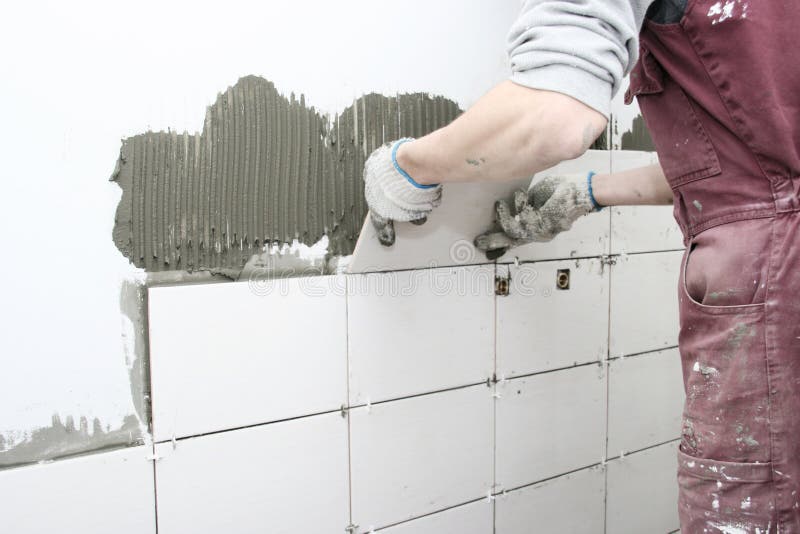 Tiled wall stock image. Image of floor, tile, hands, occupation - 17230465