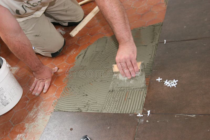 Floor tiles installation stock photo. Image of adult, arranging - 3511816