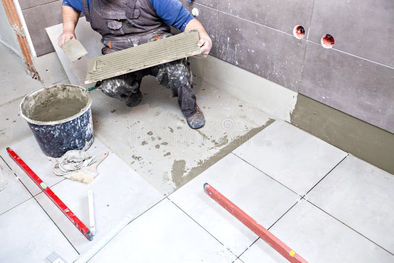 The Tiler Builder Arranges the Bathroom Ceramics. Stock Image - Image ...
