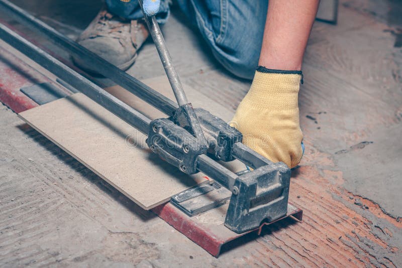 Tiler with a Hand-held Tile Cutter Stock Image - Image of ceramic ...
