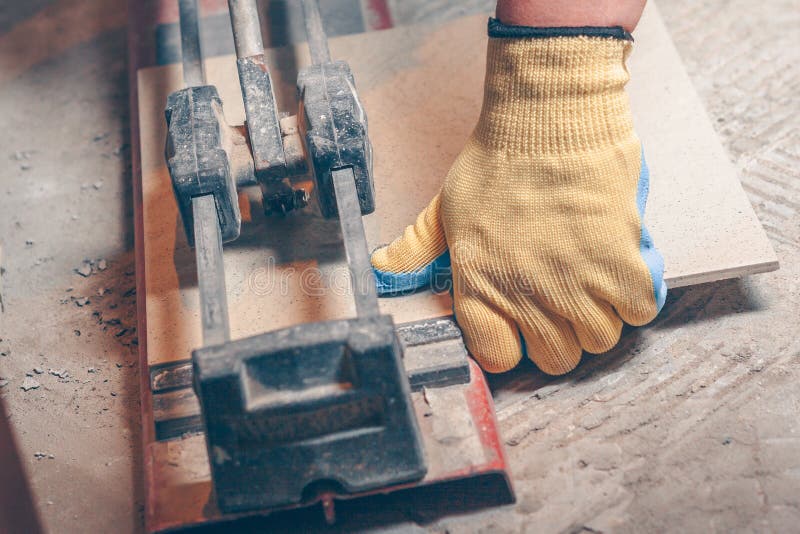 Tiler with a Hand-held Tile Cutter Stock Image - Image of laying ...