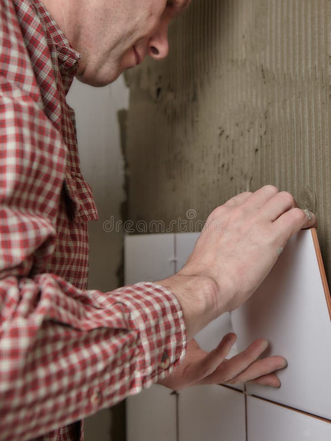 Installing Ceramic Tiles on a Floor Stock Photo - Image of redesign ...