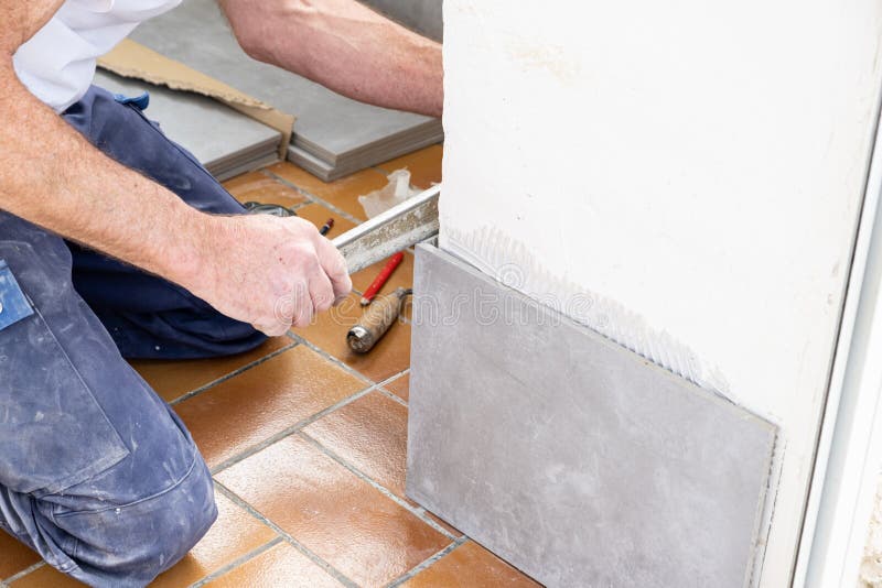 The Tiler Lays a Ceramic Tile on the Wall Stock Image - Image of cement ...