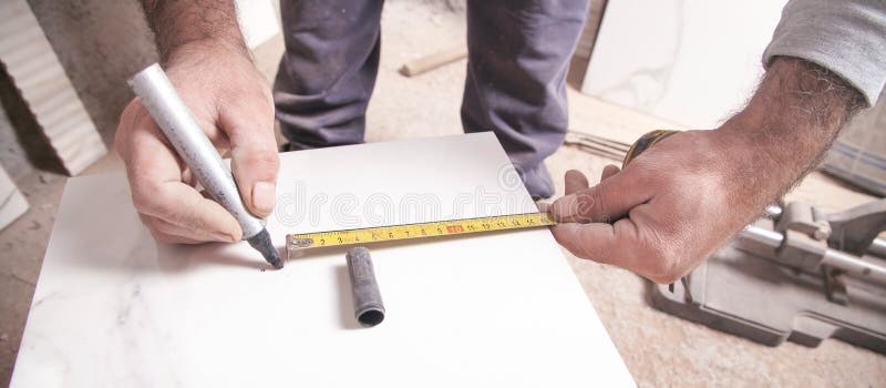 Tiler Measures and Cuts Tile Stock Photo - Image of manual, measures ...