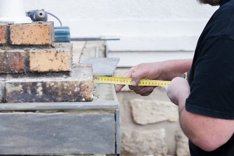 The Tiler Measures and Puts Marks To Cut and Lay a Tile Stock Image ...