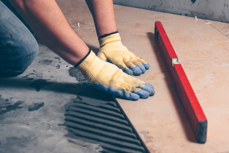 The Tiler Puts the Tile on the Floor Stock Photo - Image of manual ...