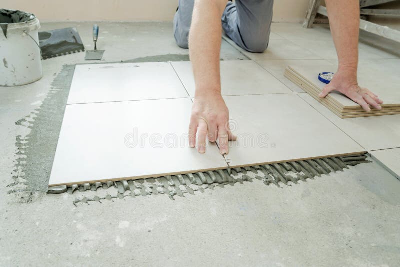 Laying Ceramic Tiles. stock photo. Image of indoor, installation - 99388604