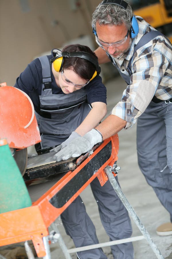 Apprentice with a grinder. stock photo. Image of body - 35895848