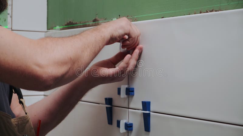 Tiler Using Tile Leveling System when Laying Ceramic Tiles on Bathroom ...