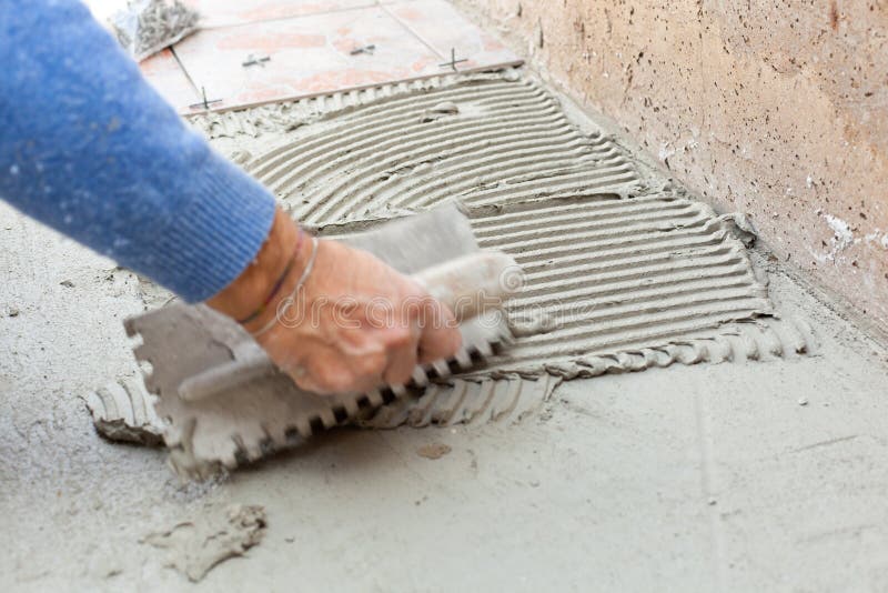 Tiler works with flooring stock photo. Image of mason - 38741022