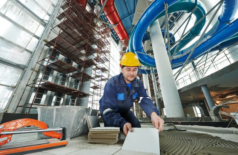 Two Tilers at Industrial Floor Tiling Renovation Stock Image - Image of ...