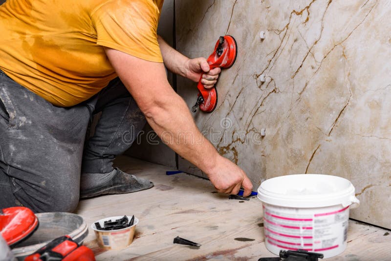 Tilers Installing Large Format Tiles on Wall. Stock Photo - Image of ...