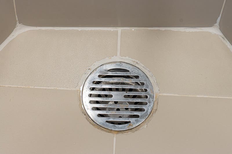 The Tiles Floor with a Grid on the Drain Hole in Bathroom with Shower ...
