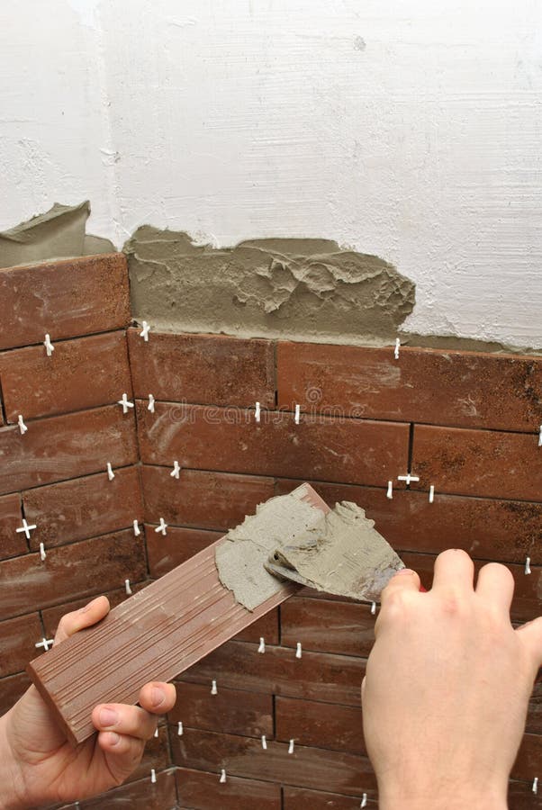 Tiling a Wall stock photo. Image of decorating, interior - 17026614