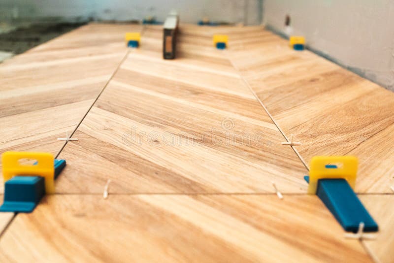 Tiling Work. Layed Tiles with Crosses for Tiles and 3d Crosses Stock ...