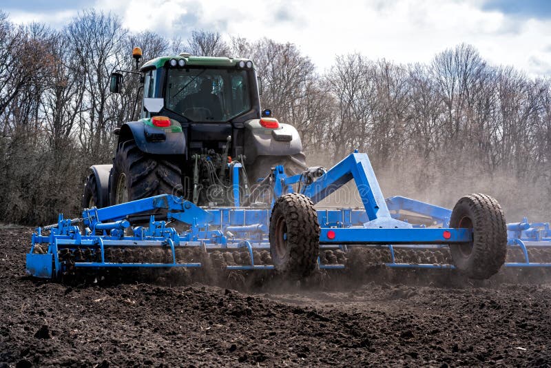 Tillage in Early Spring. Tractor with Aggregate Stock Image - Image of ...