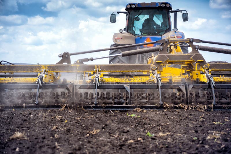 Tillage in the Field with a Tractor with a Trailed Machine Stock Image ...