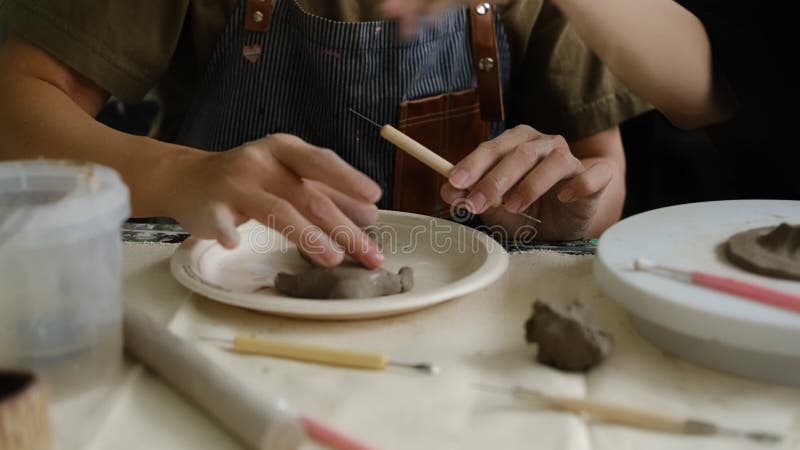Tilt Up Shot of Young Creative Man Creating Pottery Ceramics Statuette ...