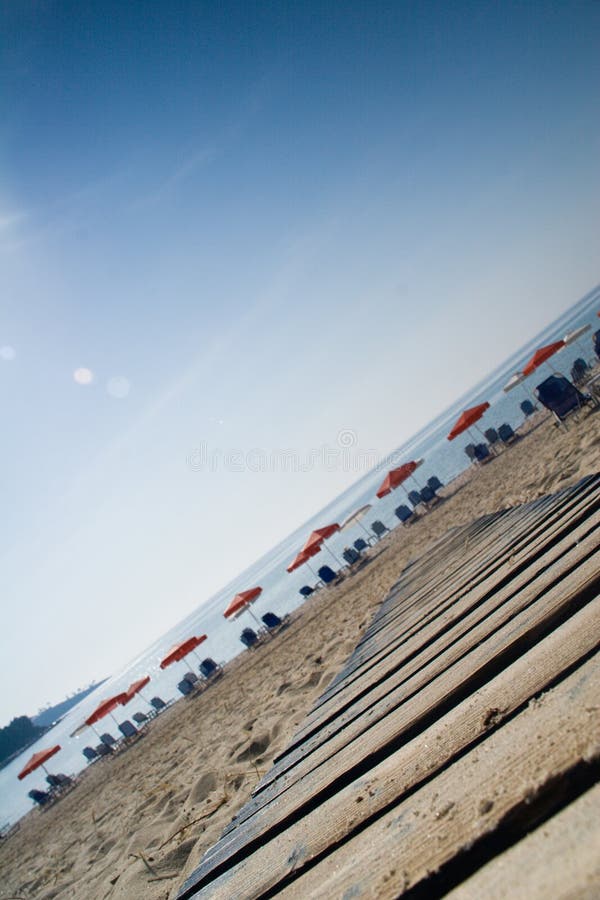 Tilted beach stock photo. Image of light, horizon, deckchair - 31614142