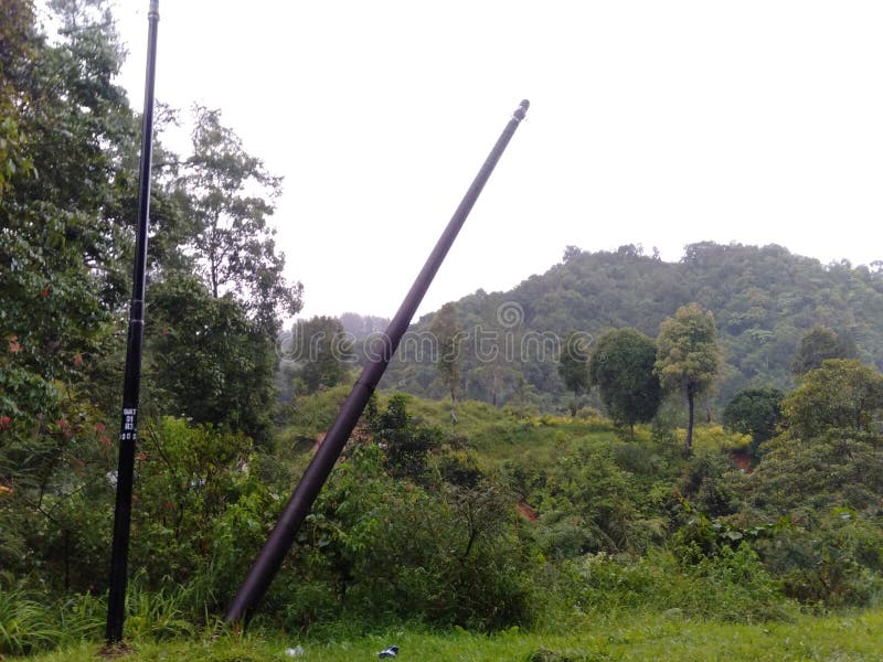 A Tilted Electric Pole on the Edge of a Ravine at the Foot of the ...