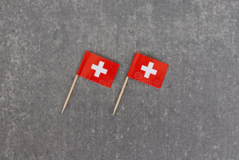 Tilted Pair of Switzerland Flags on Gray Background Stock Image - Image ...