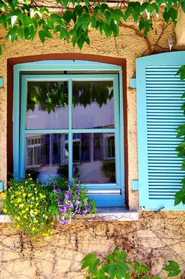 Tilted Window With Turquoise Frame And Shutter With Flowers Stock Photo ...
