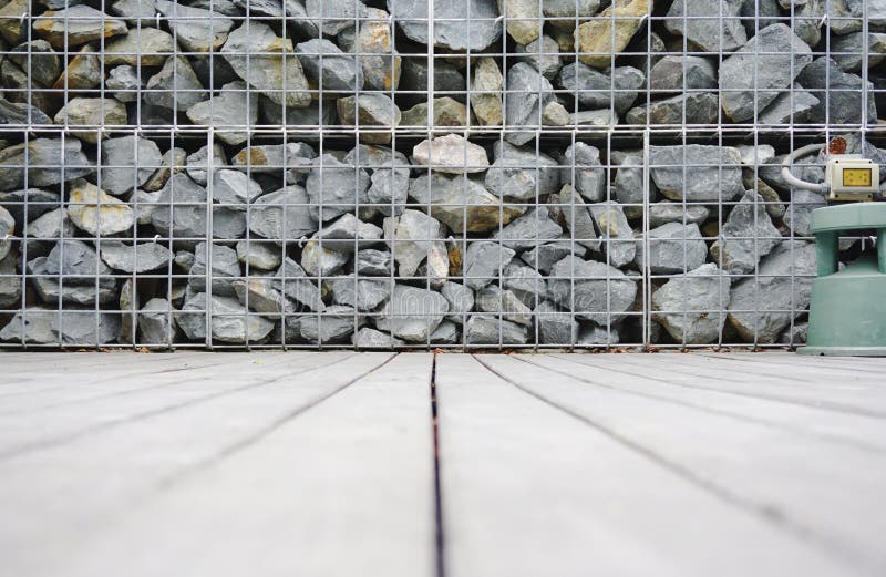 Timber Deck with Rock Wall Background Stock Image - Image of ...