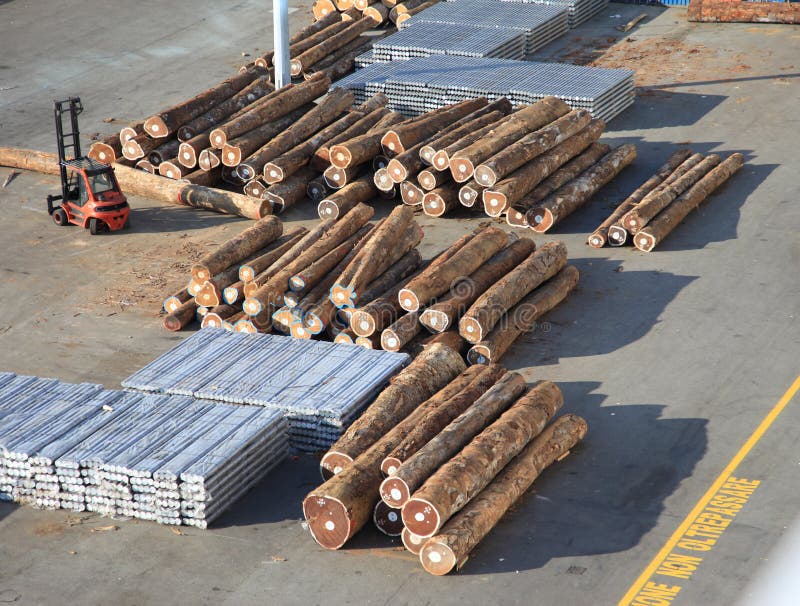 Timber logs on the dock stock image. Image of wharf, steel - 58584381