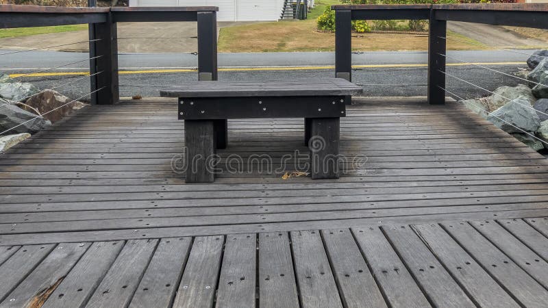 Timber Resting Stool on Boardwalk Stock Image - Image of wire, urban ...