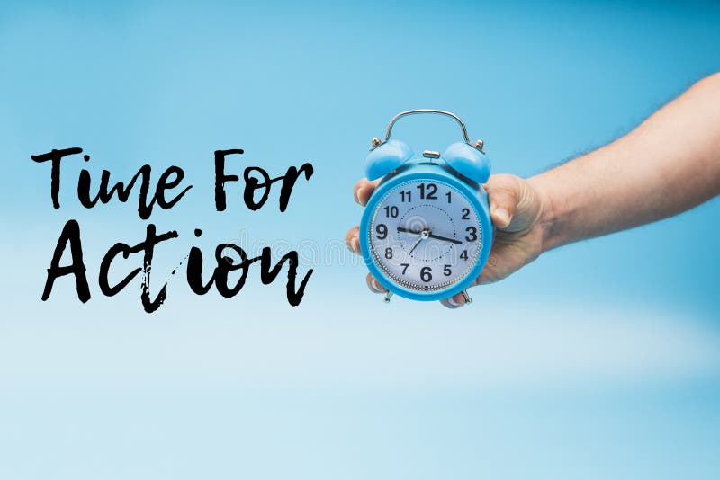Time for Action and a Hand Holding a Blue Analog Alarm Clock Stock ...