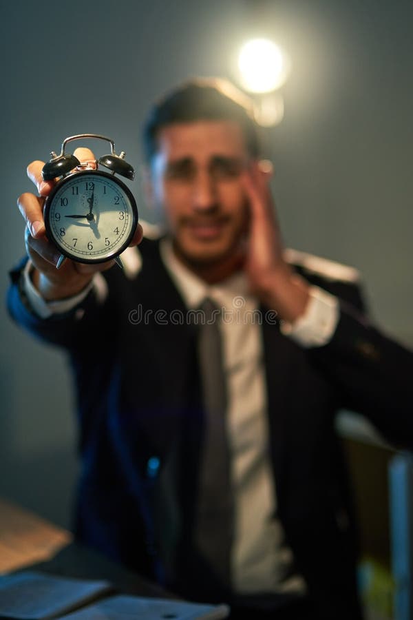 Time is an Asset, Use it Wisely. a Stressed Out Businessman Holding a ...