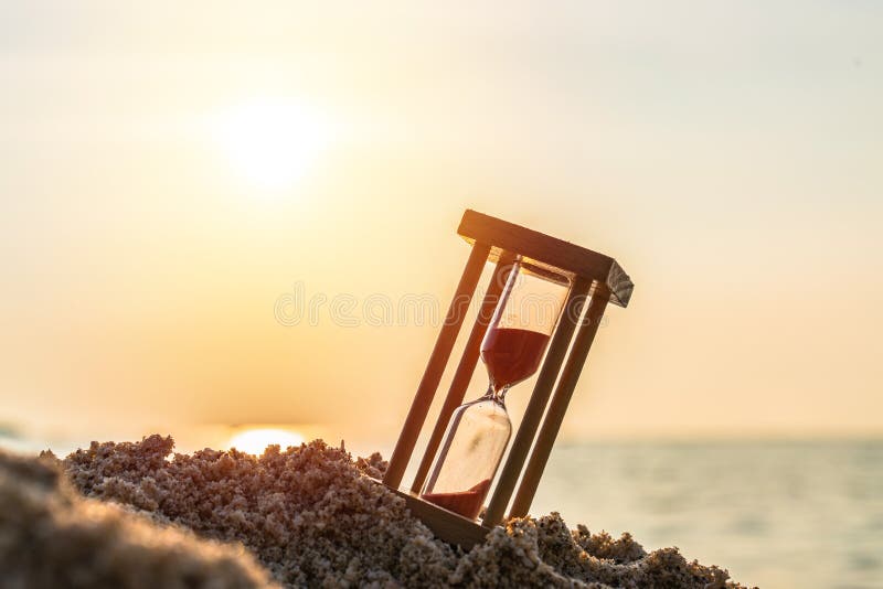 Time Concept Hourglass On Sandy Beach In Summer With Sea Background ...