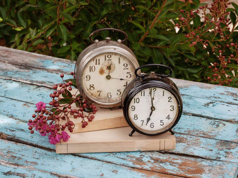 Time Concept. Two Old Clock and Old Books Stock Photo - Image of books ...