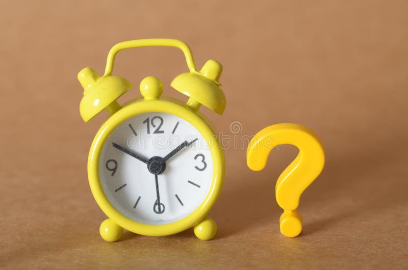 Time Dilemma: Yellow Alarm Clock and Question Mark on Neutral ...