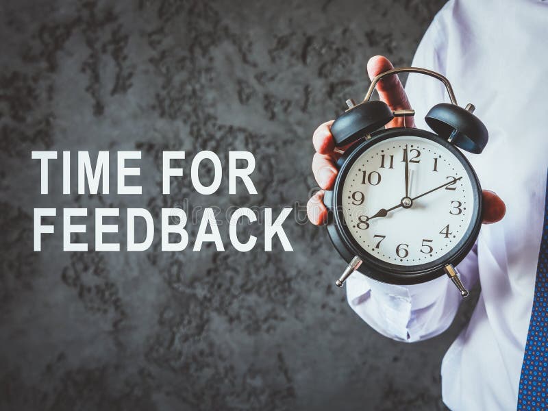 Time for Feedback. Man Shows Alarm Clock. Stock Image - Image of ...