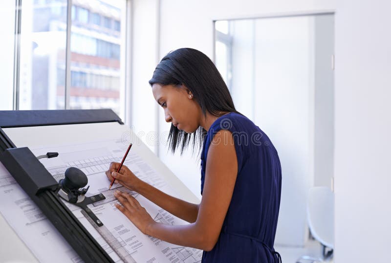 Time Flies at the Drawing Board. an Attractive Female Architect Working ...