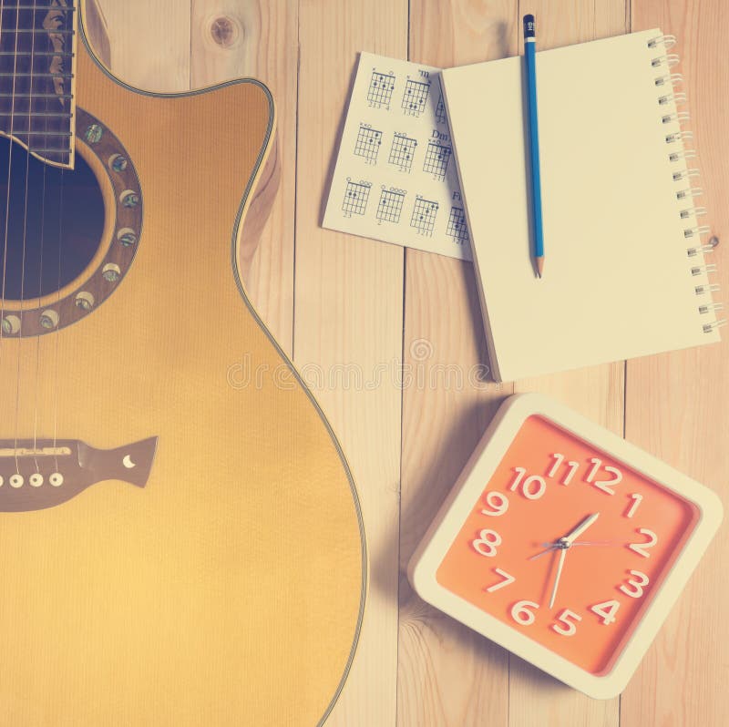 Time for Guitar Song Writing with a Red Clock. Stock Image - Image of ...